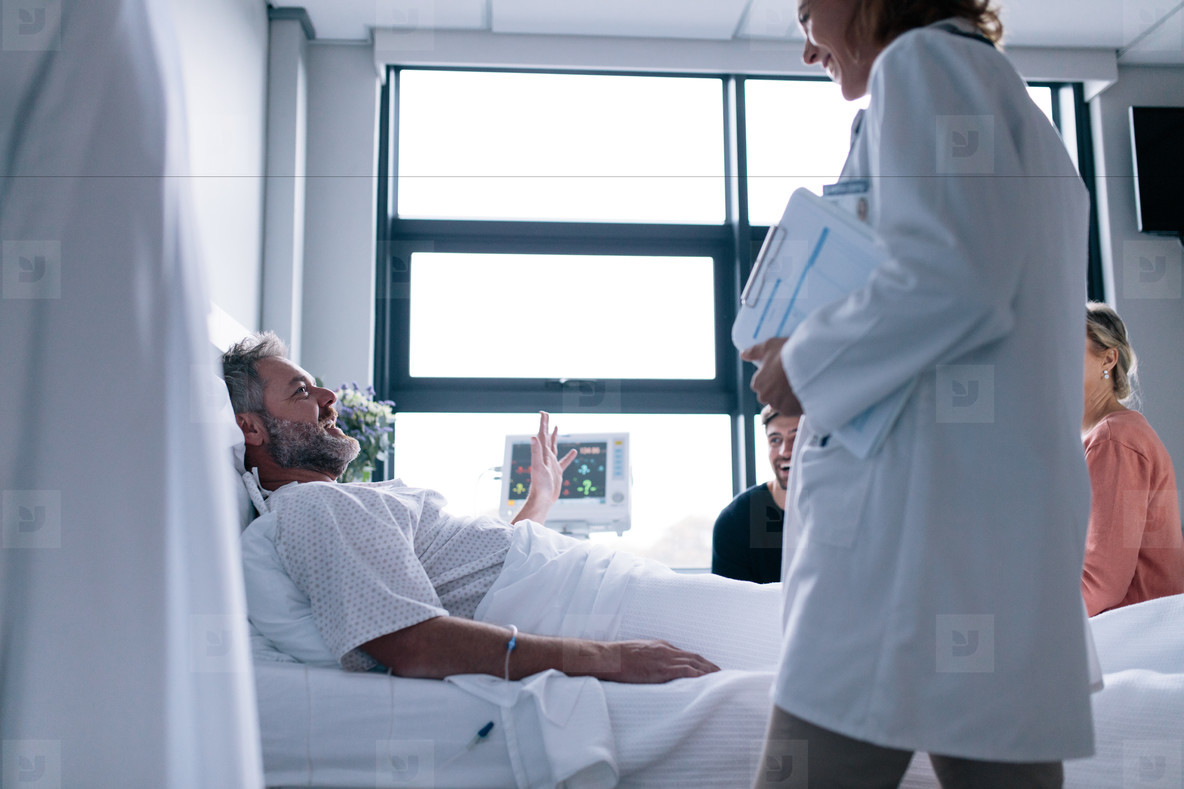 Female doctor visiting patient in hospital room stock photo (131188 ...
