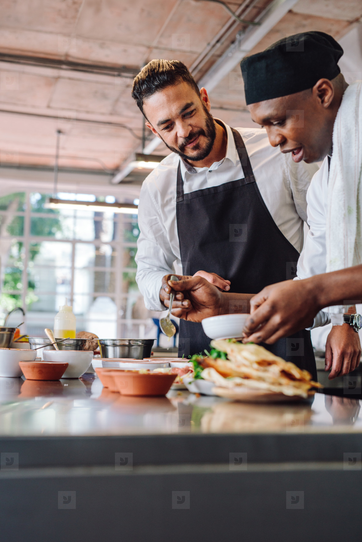 Chefs cooking new food dish in kitchen stock photo (133179 ...