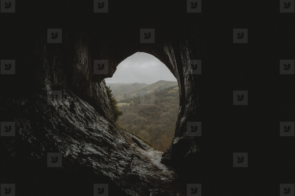 Rugged rock cave with scenic view Peak District National Park 1 stock ...