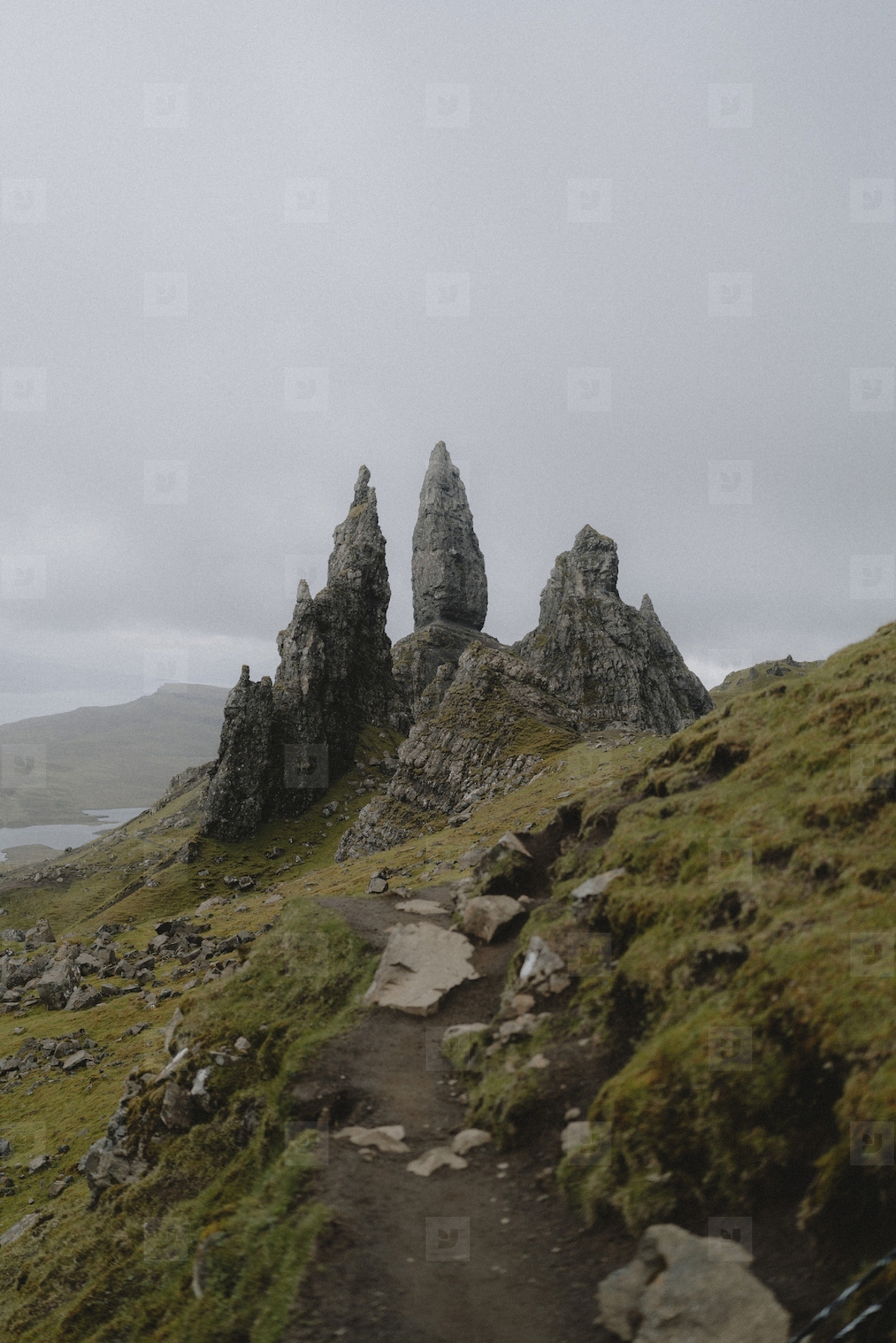 Rock formation on grassy slope stock photo (274465) - YouWorkForThem